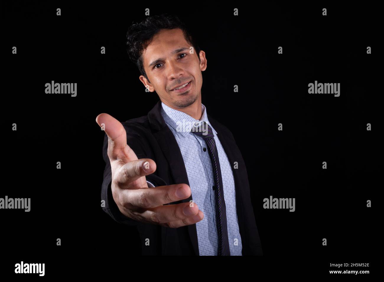 Businessman stretching out his hand to shake hands. Man asking for a ...