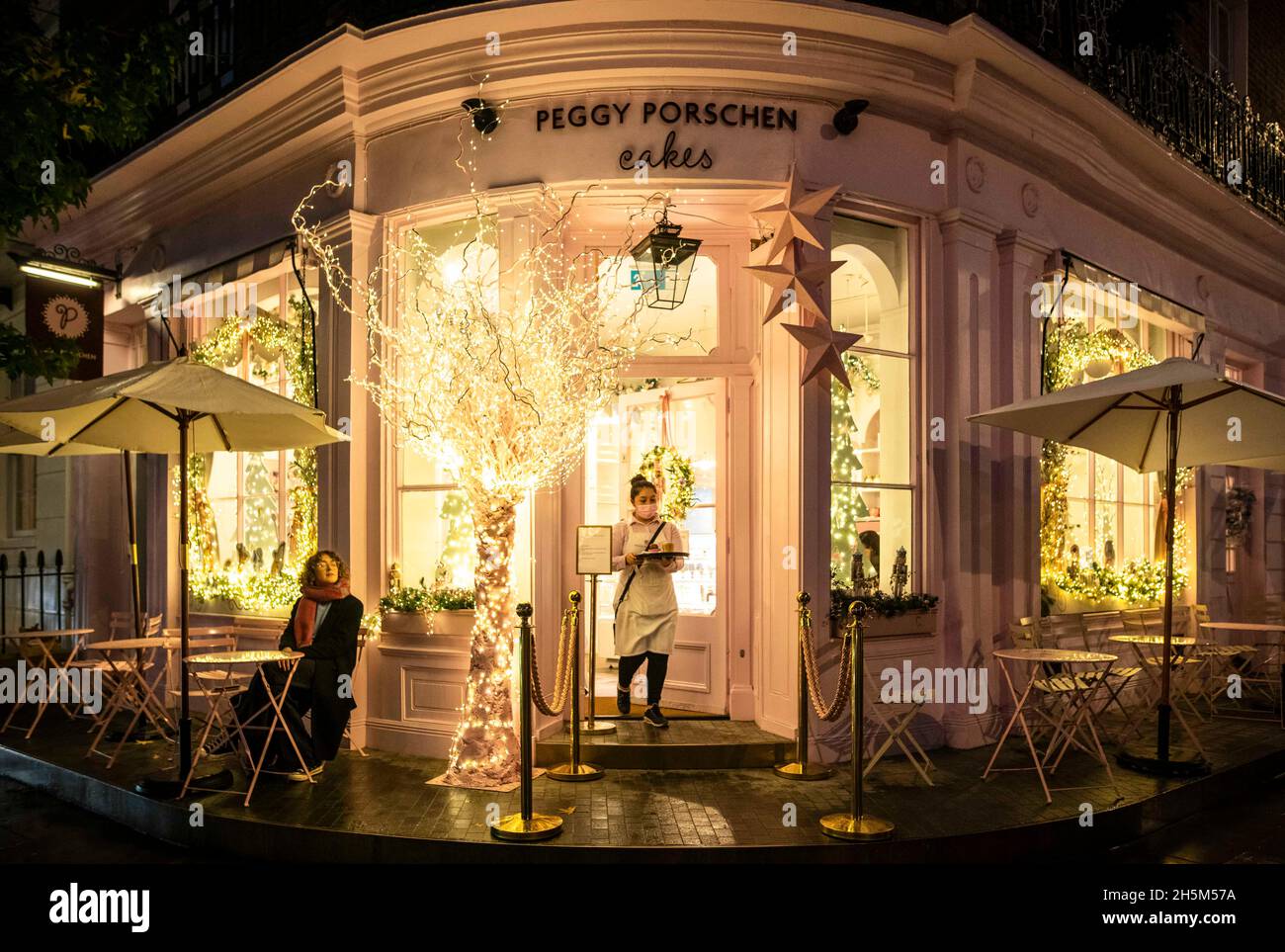 EDITORIAL USE ONLY Customers at Peggy Porschen enjoy the bakery's ...