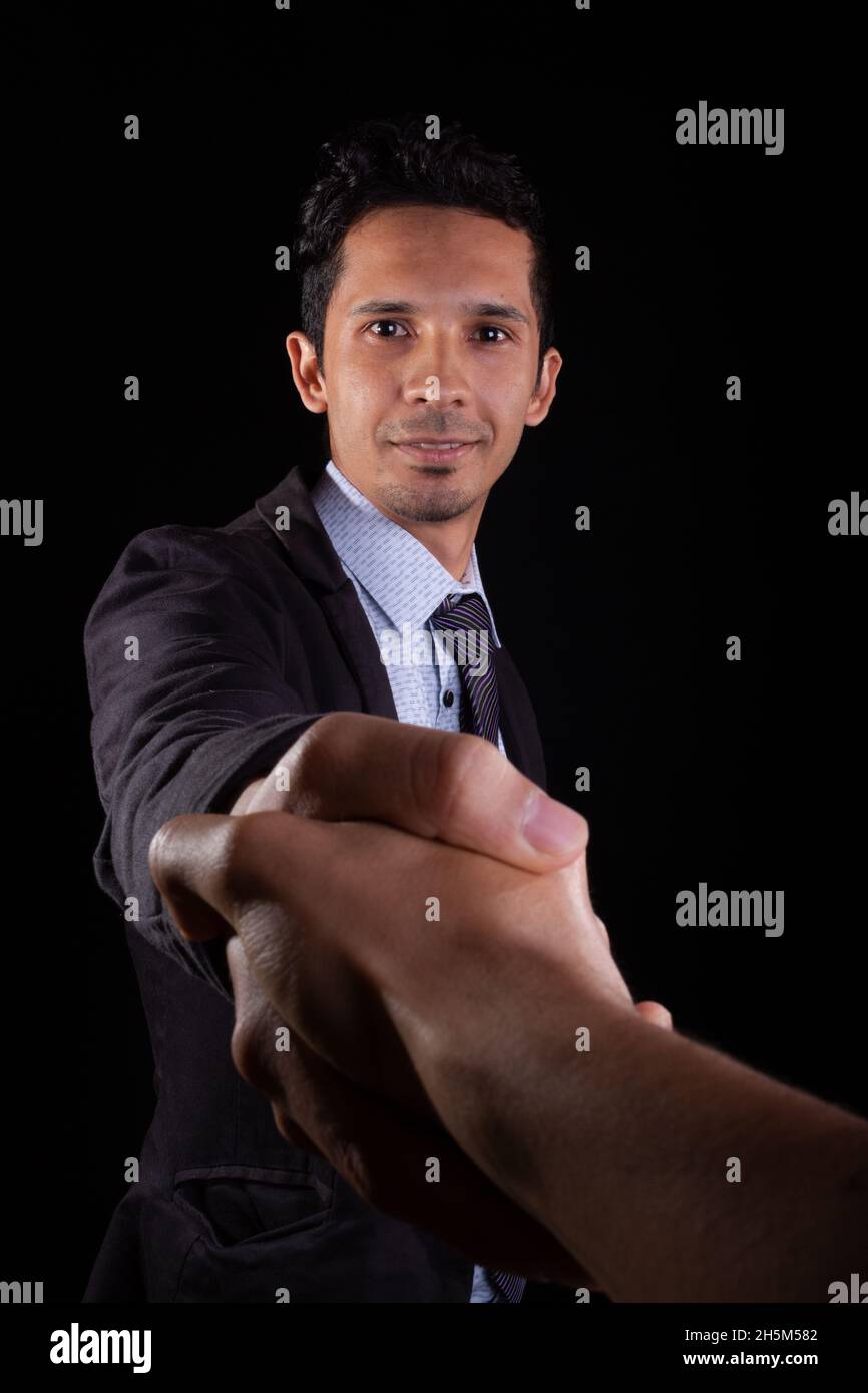 Vertical photo of a businessman shaking hands. Two hands shaking hands ...