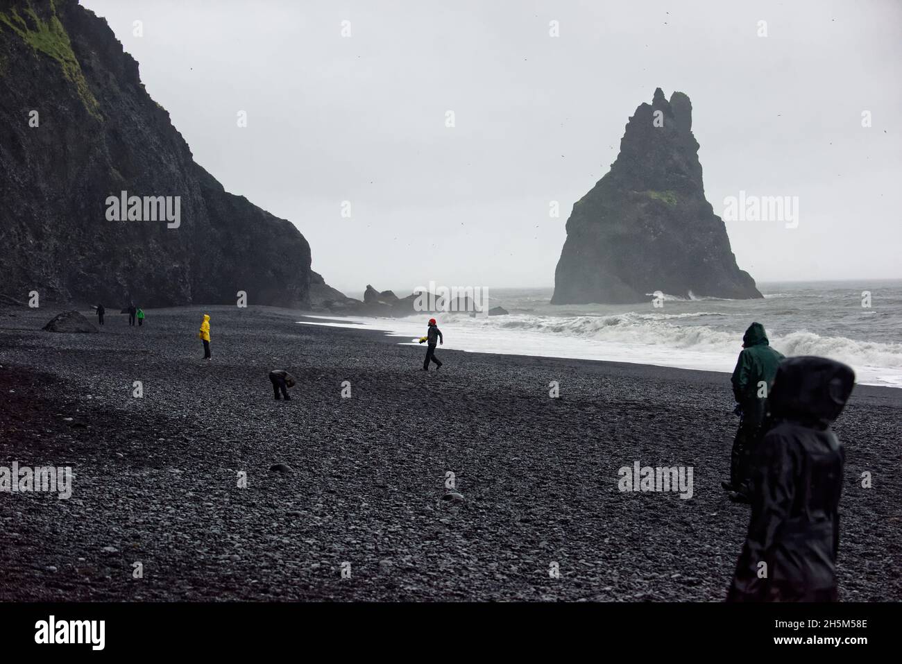 The Reynisdrangar basalt sea stacks and the Reynisfjara black sand ...