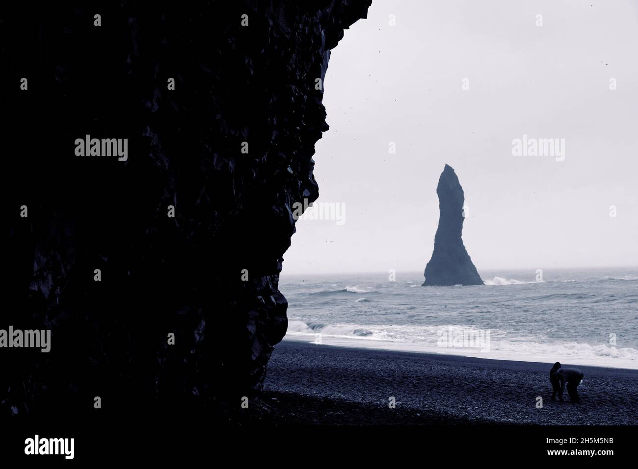 The Reynisdrangar basalt sea stacks and the Reynisfjara black sand ...