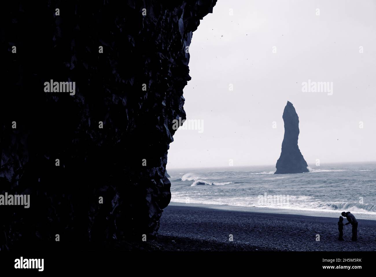 The Reynisdrangar basalt sea stacks and the Reynisfjara black sand ...
