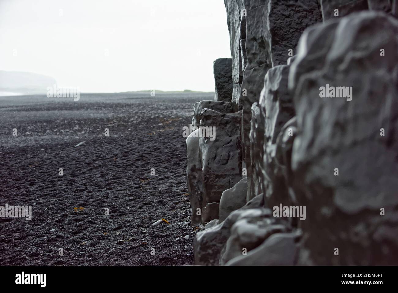The Reynisdrangar basalt sea stacks and the Reynisfjara black sand ...