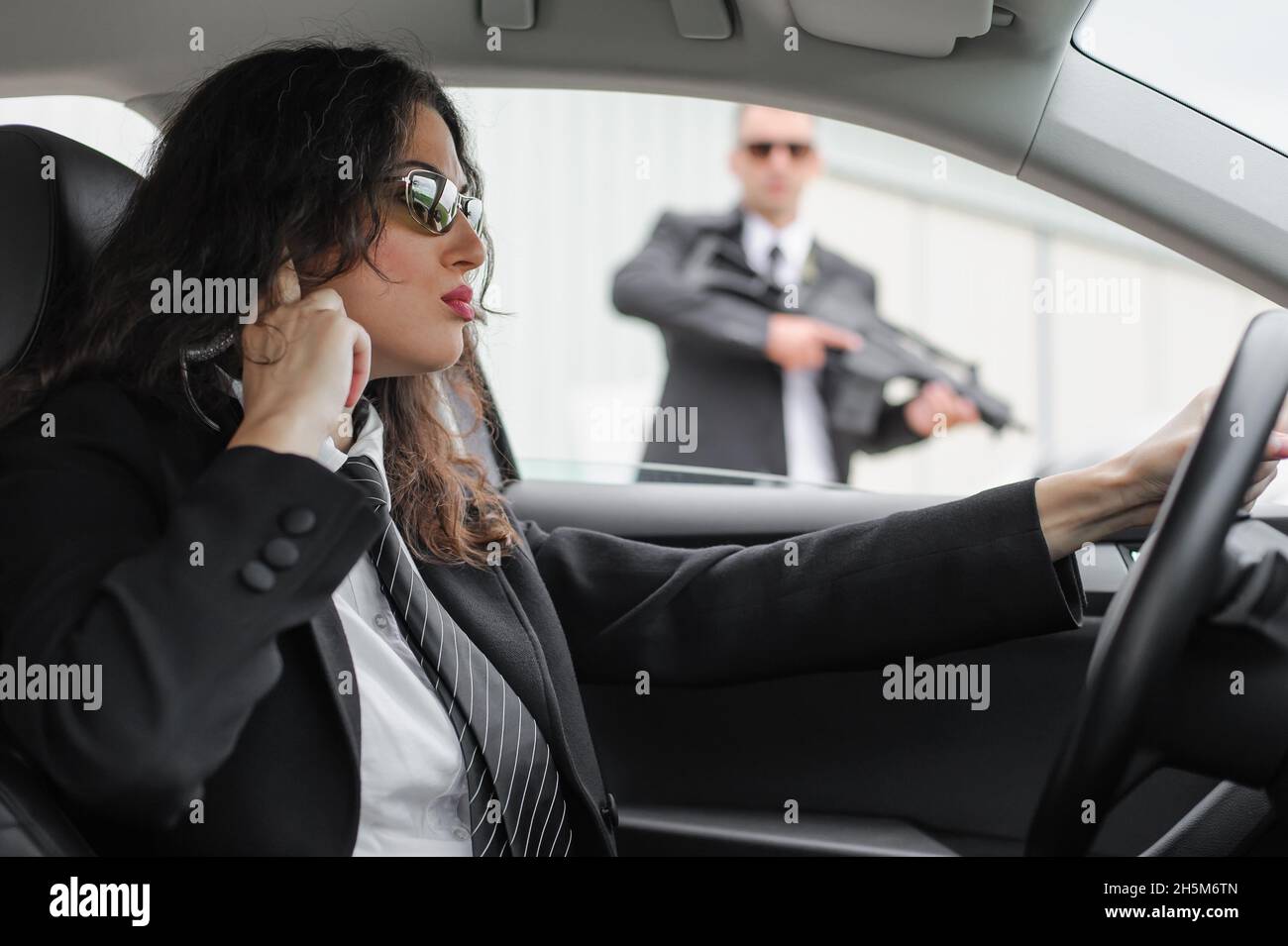 Professional armed team of female and male bodyguards protect celebrity ...