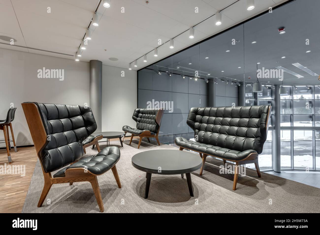 resting lounge place with luxury armchairs in a modern office with ...