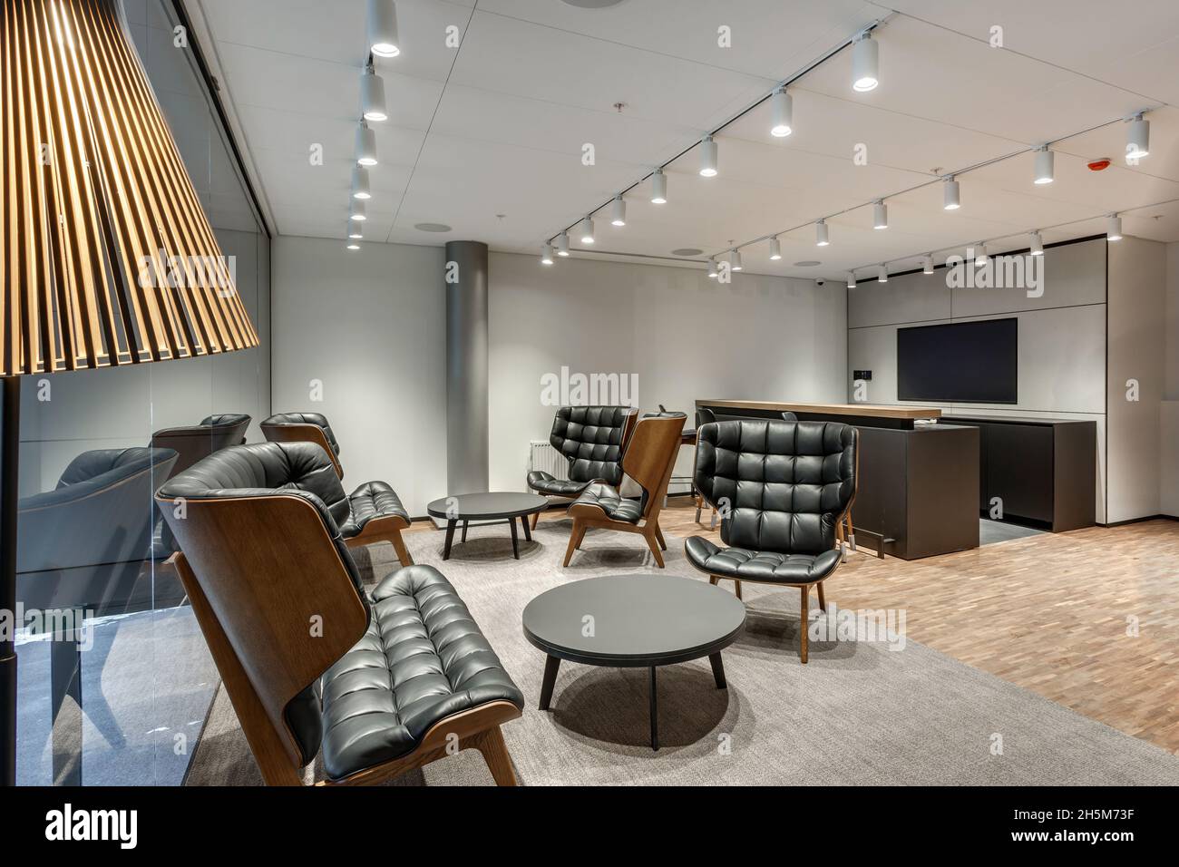 resting lounge place with luxury armchairs in a modern office with ...