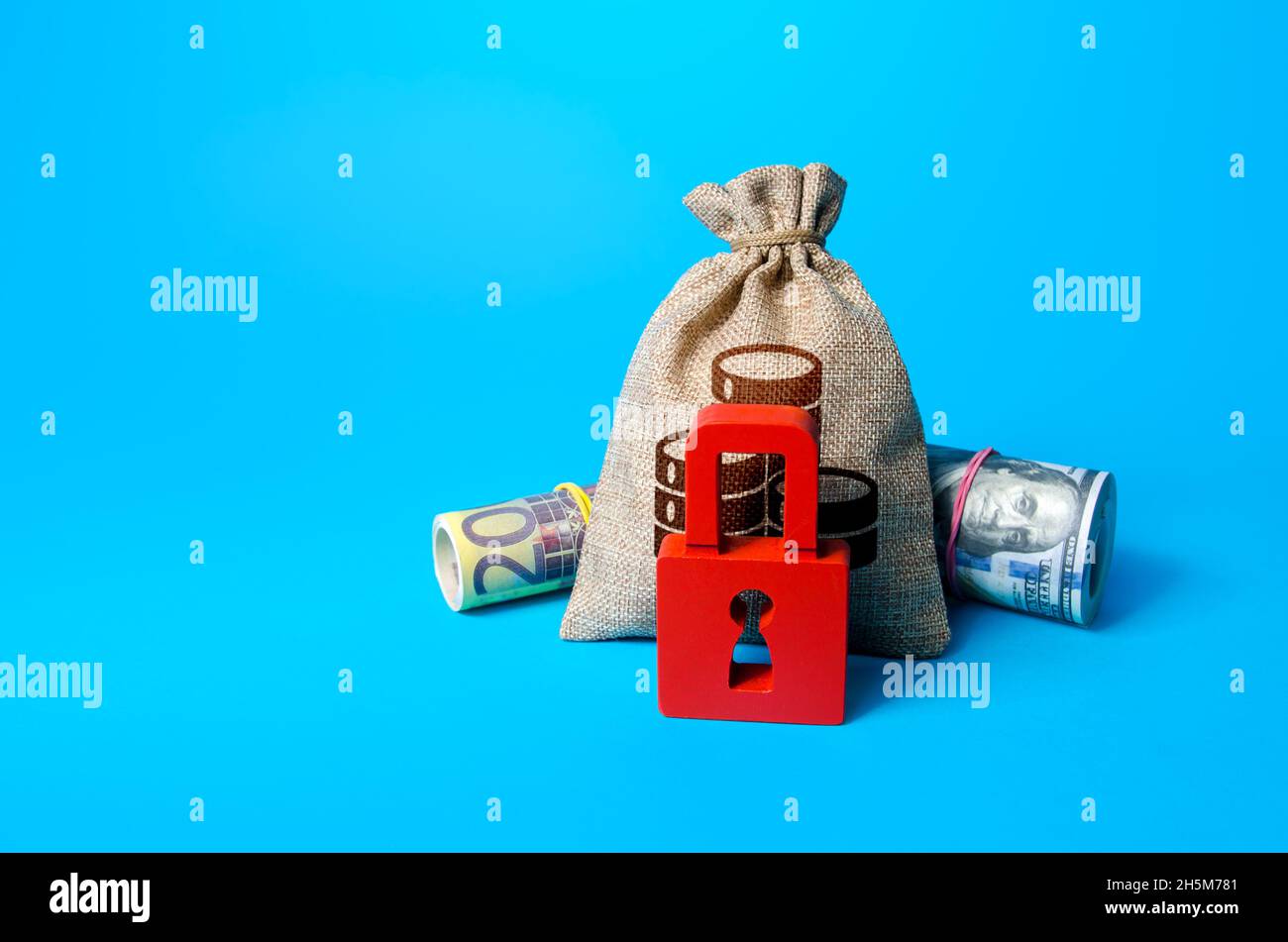 Money bag and red padlock. Sanctions and Restrictions. Freezing of ...