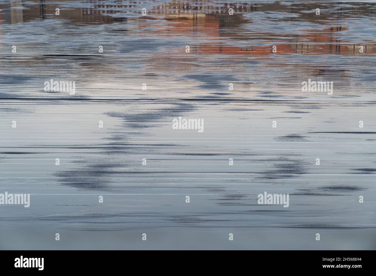 Wet ice rink surface. Skating arena filled with water for winter season ...