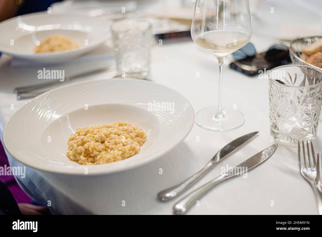 Italian rice risotto served hot in a deep plate in a restaurant Stock ...