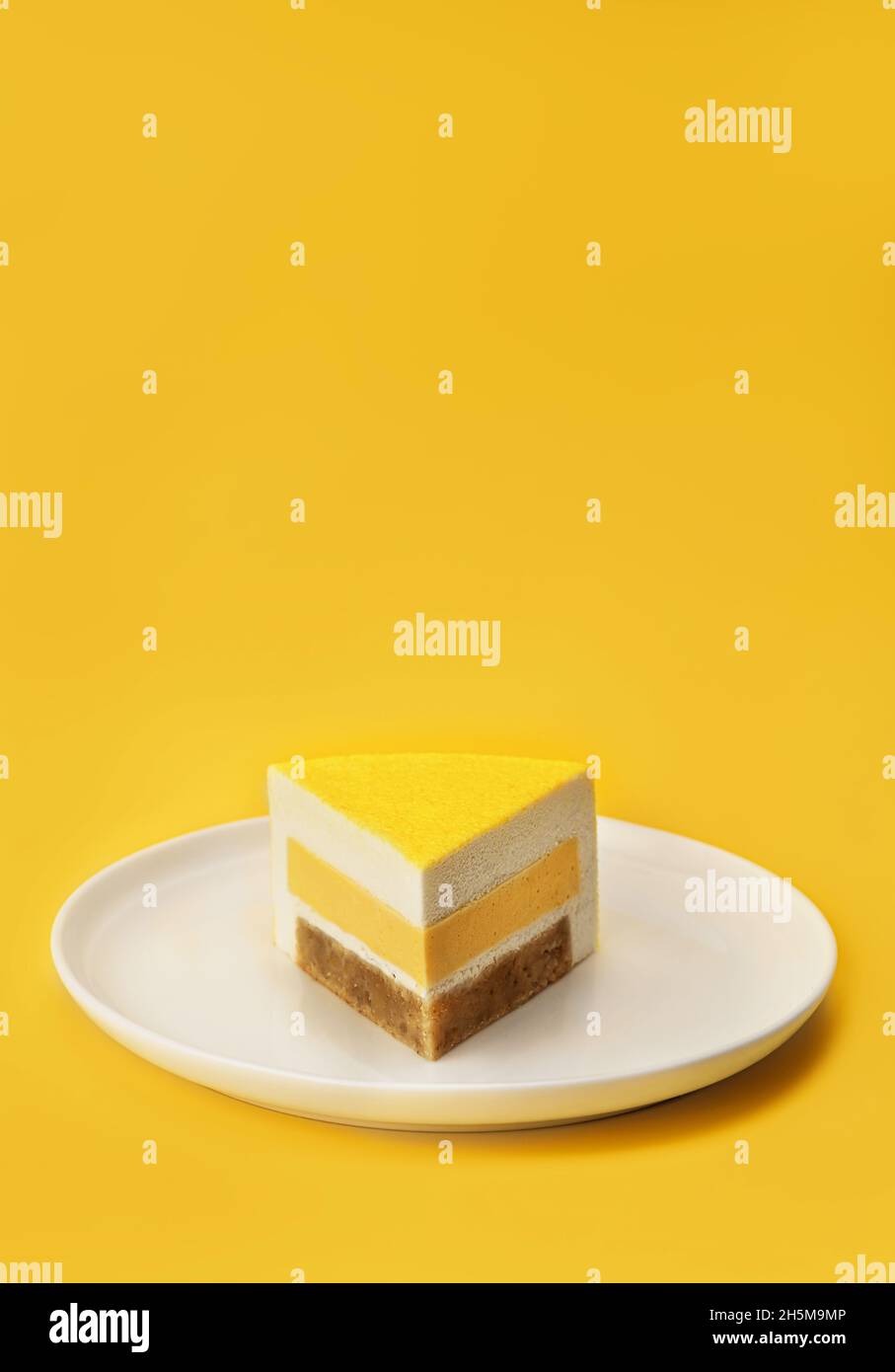 Delicious mango and passion fruit mousse cake slice with the layers and ...