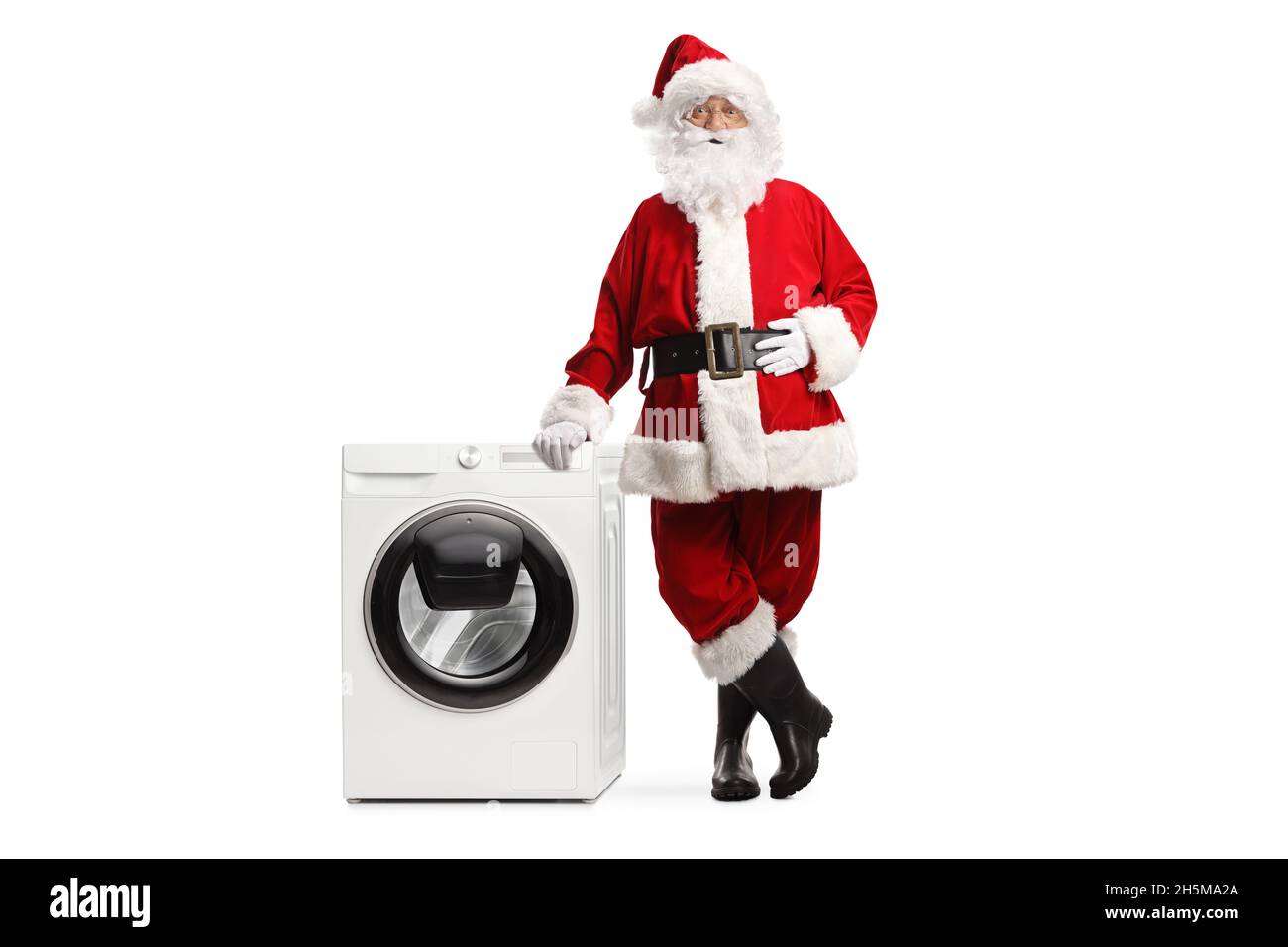 Santa Claus leaning on a washing machine isolated on white background ...