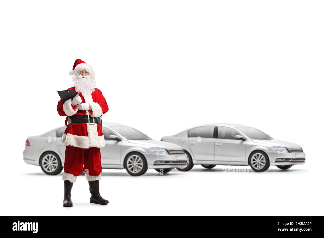 Full length portrait of Santa claus holding a clipboard and standing in ...