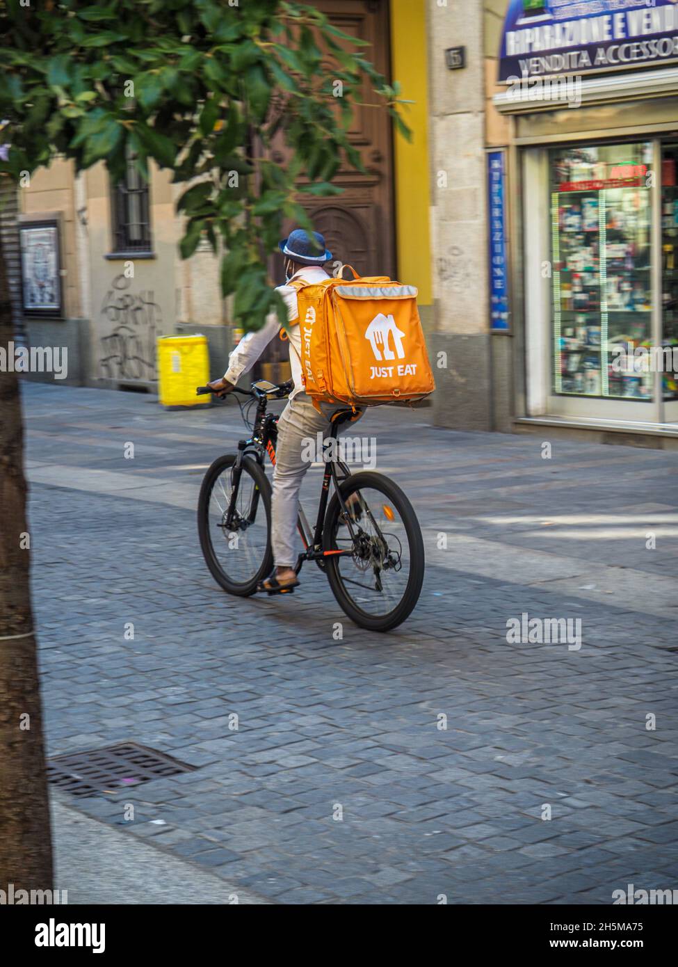 App delivery riders and transporter in the center of Milan Italy Stock ...