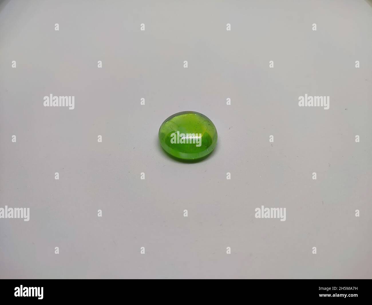 Natural green stone on white background Stock Photo - Alamy
