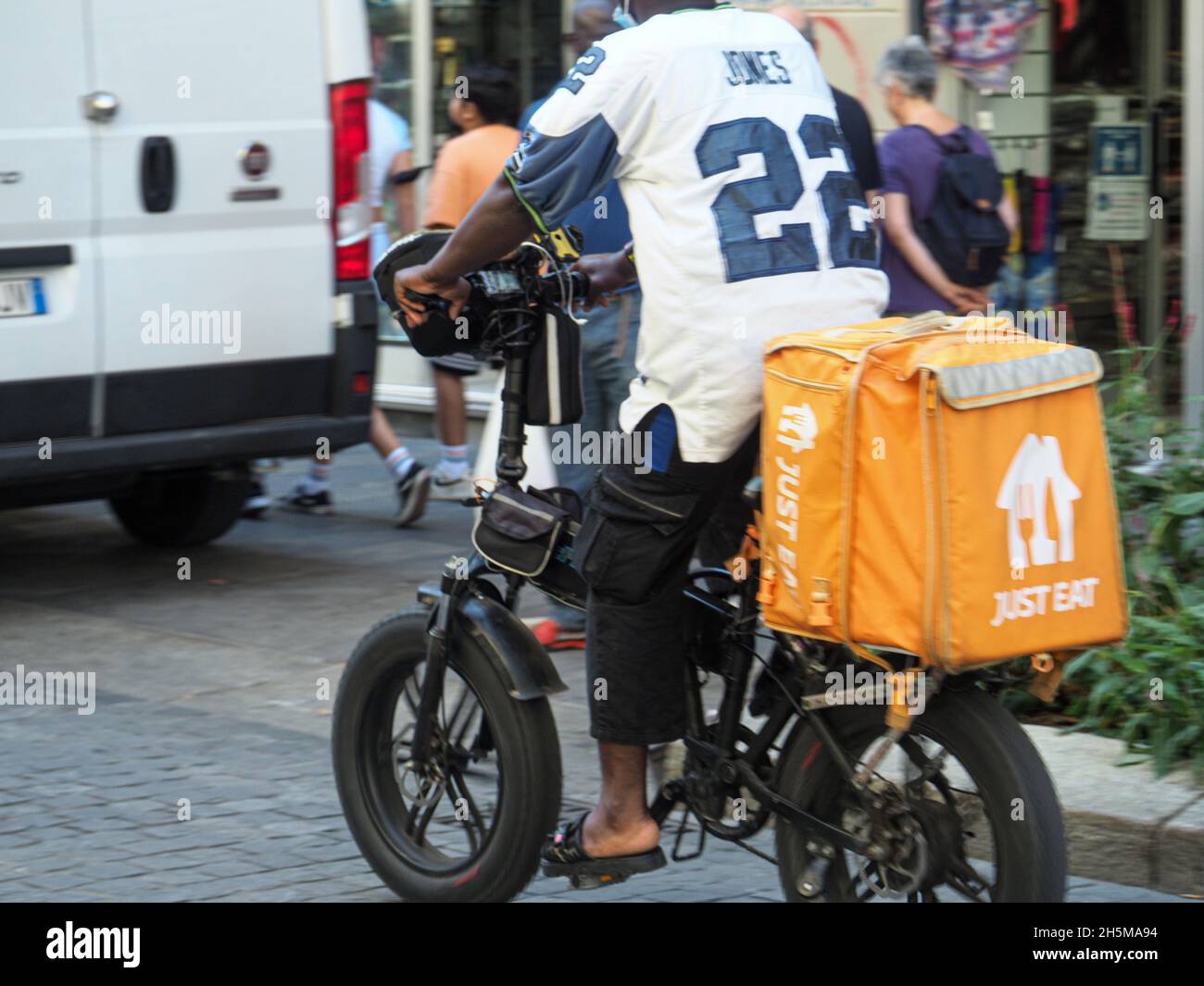 App delivery riders and transporter in the center of Milan Italy Stock ...