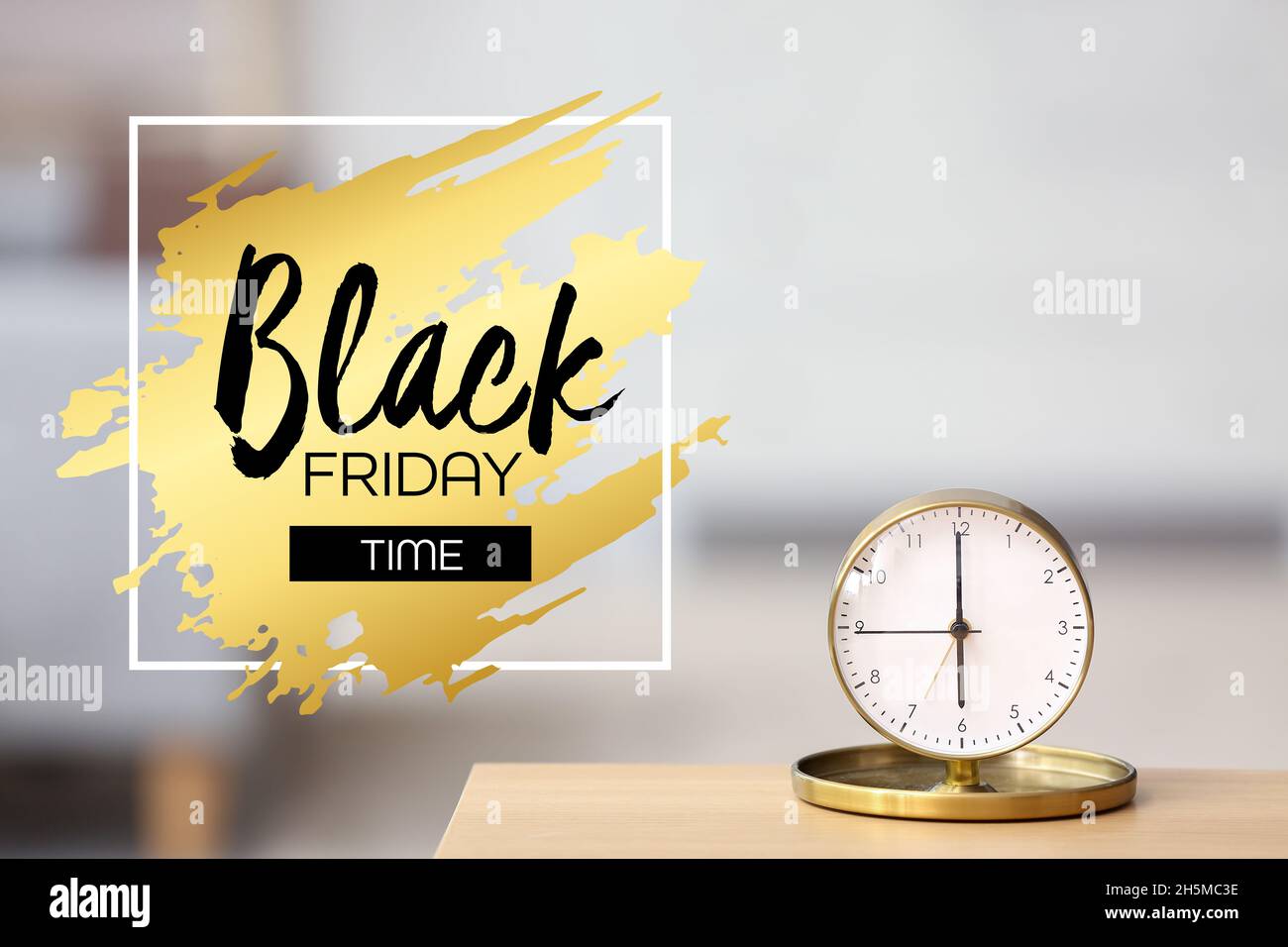 Alarm clock on table in room. Black Friday time Stock Photo - Alamy