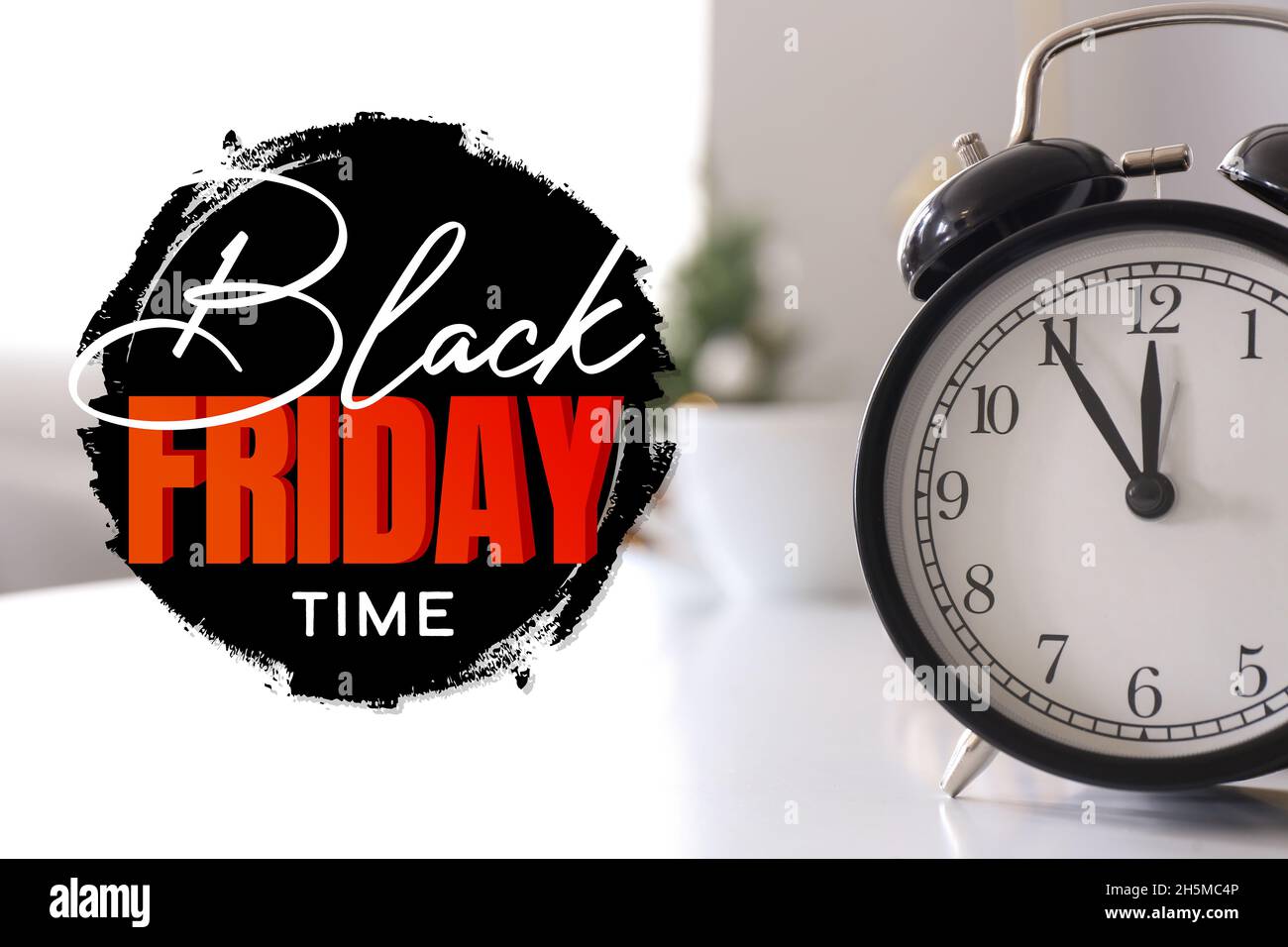 Alarm clock on table in room. Black Friday time Stock Photo - Alamy