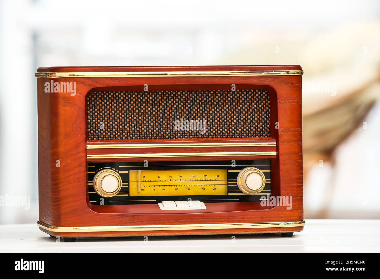 Vintage radio receiver on table in room Stock Photo - Alamy