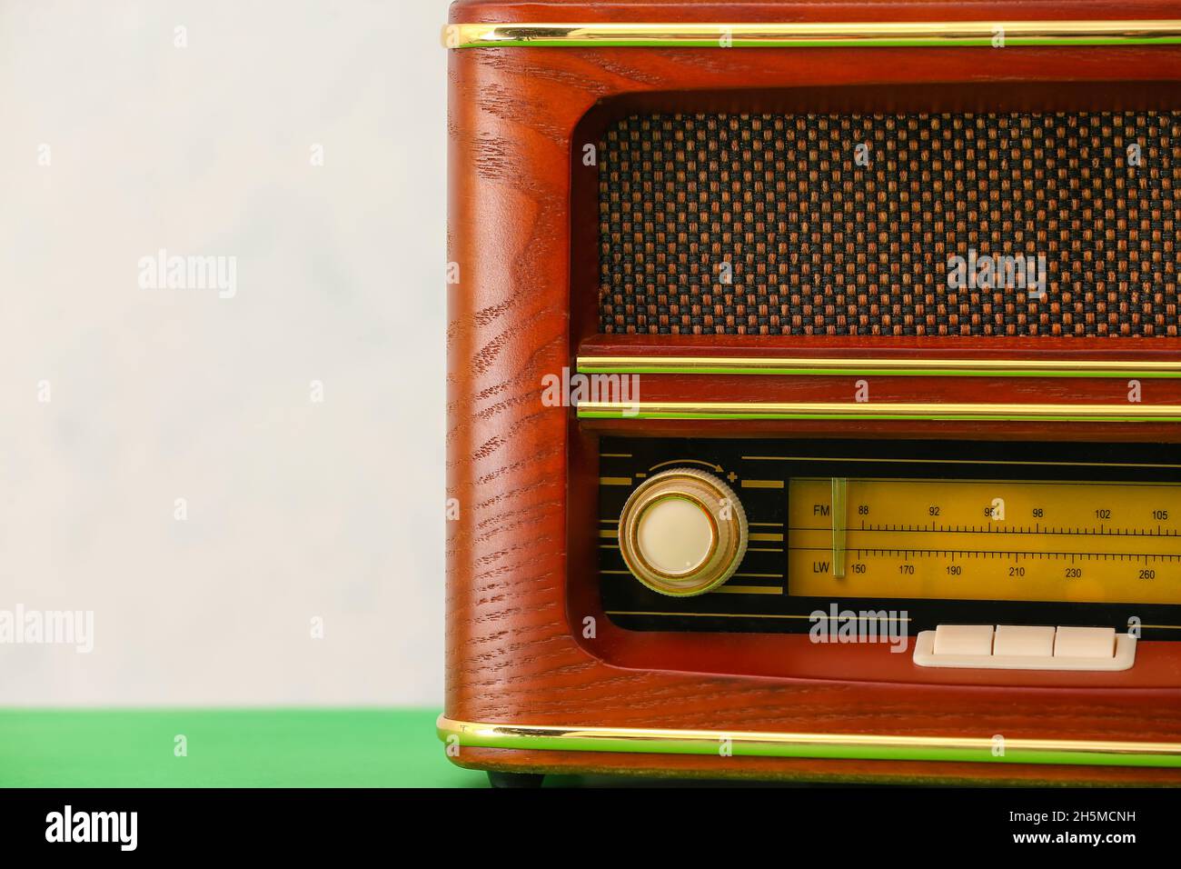 Retro radio receiver on light background Stock Photo - Alamy