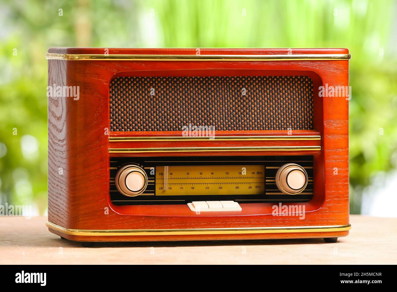 Retro radio receiver on table outdoors Stock Photo - Alamy