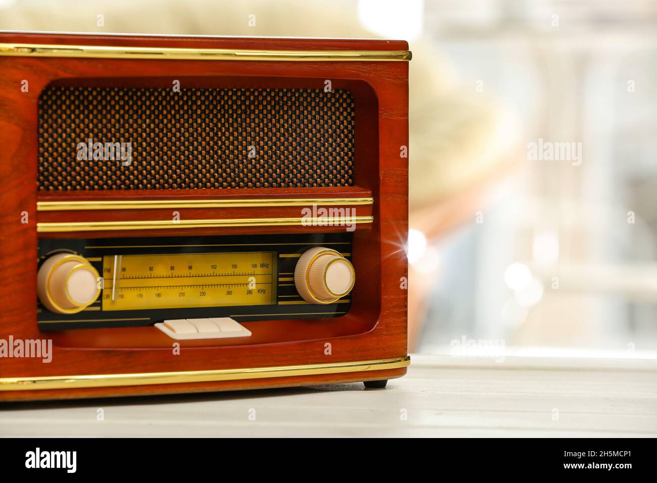 Vintage radio receiver on table in room Stock Photo - Alamy