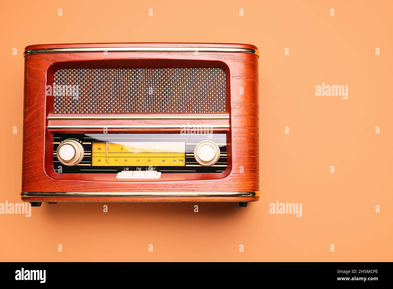Vintage radio receiver on color background Stock Photo - Alamy