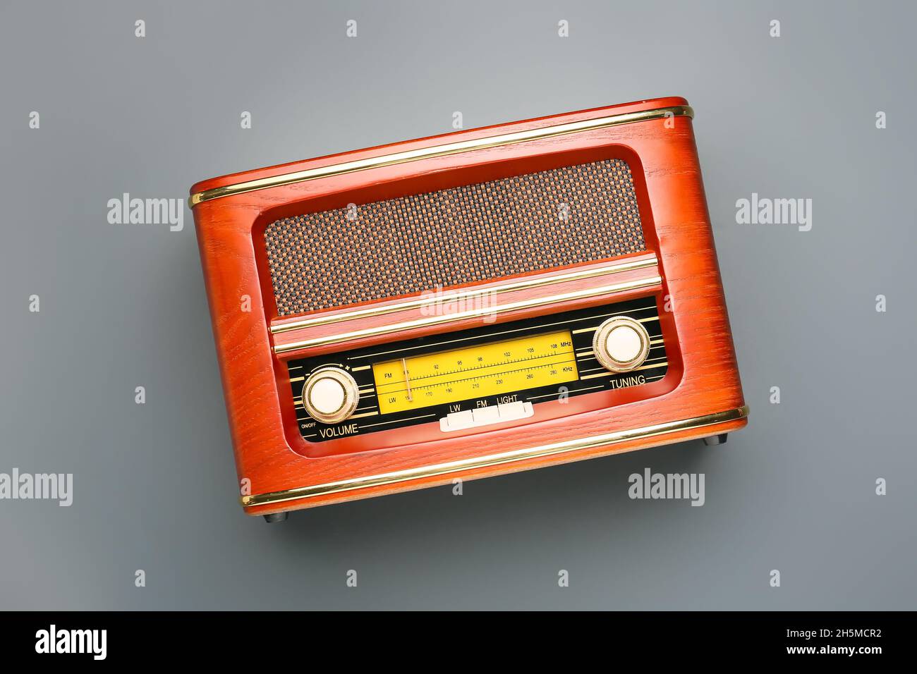 Retro radio receiver on grey background Stock Photo - Alamy