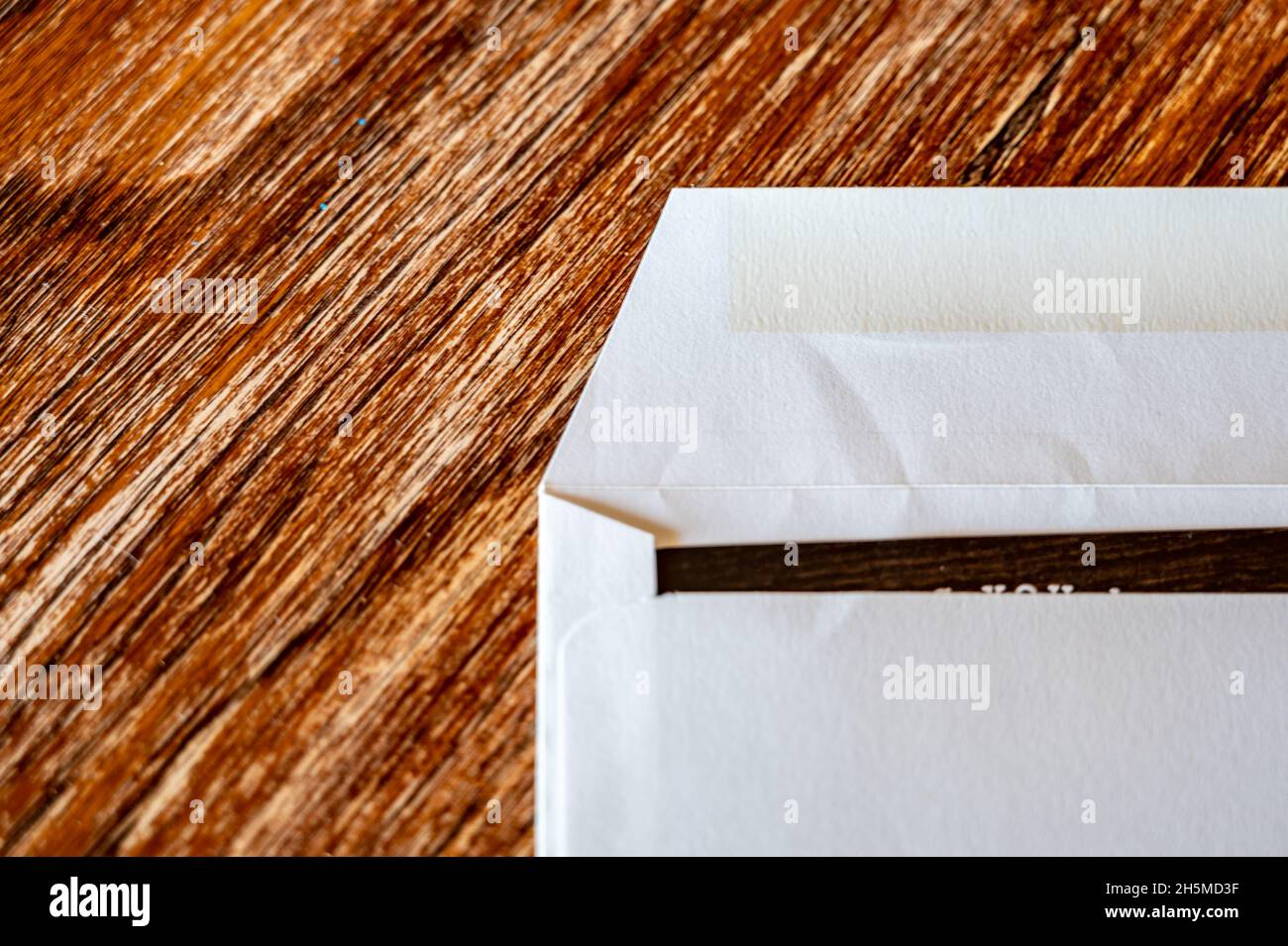 blank envelope ready to be sealed and sent in the mail. Dark colored ...