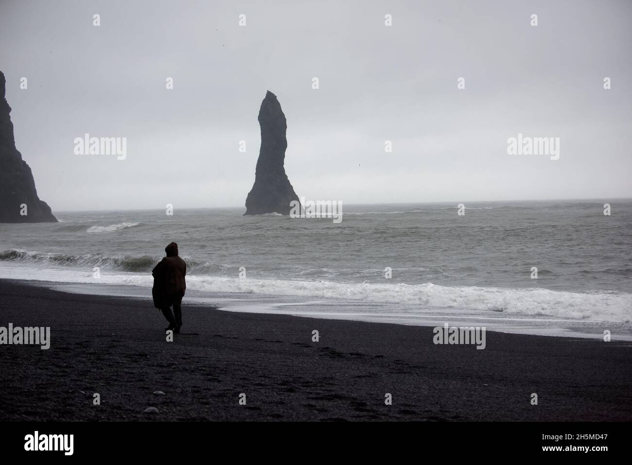 The Reynisdrangar basalt sea stacks and the Reynisfjara black sand ...