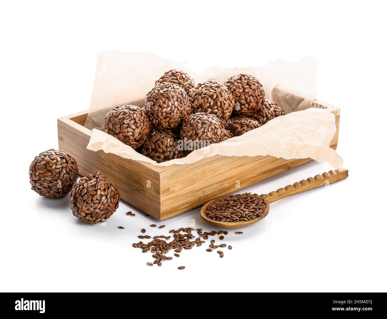 Box with tasty flax seed candies on white background Stock Photo - Alamy