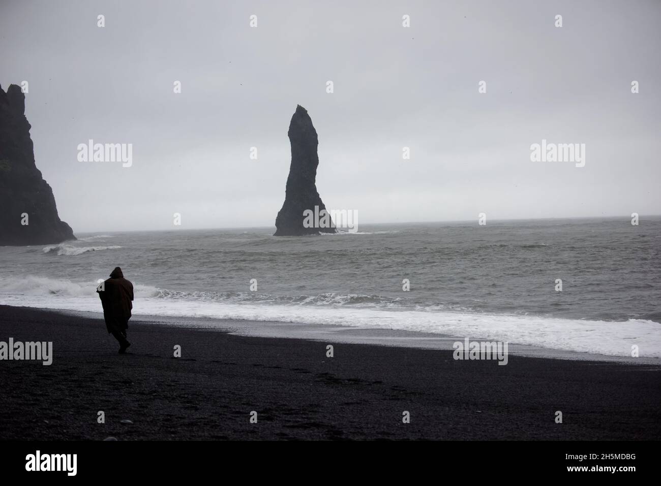 The Reynisdrangar basalt sea stacks and the Reynisfjara black sand ...