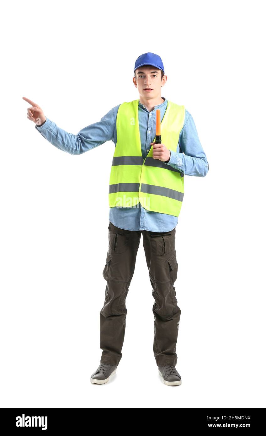 Young male worker with flashlight stick pointing at something on white ...