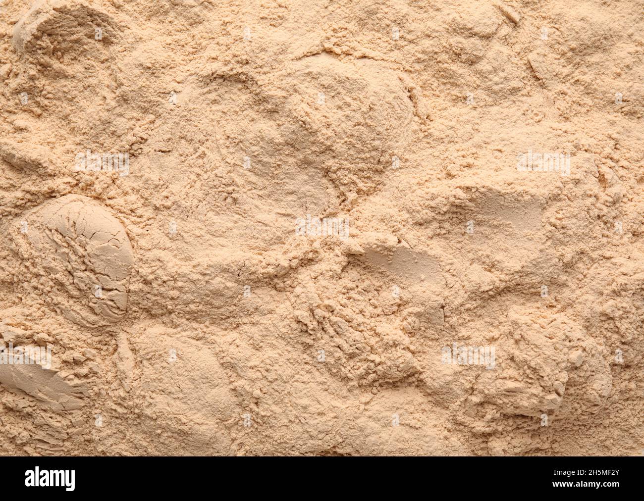 Whey protein powder as background Stock Photo - Alamy
