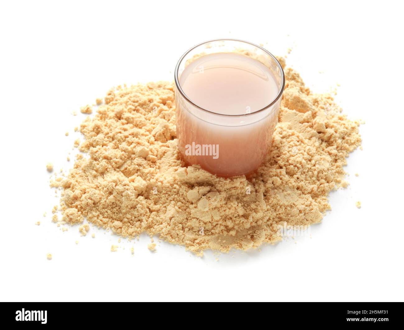 Glass of protein shake and powder on white background Stock Photo - Alamy