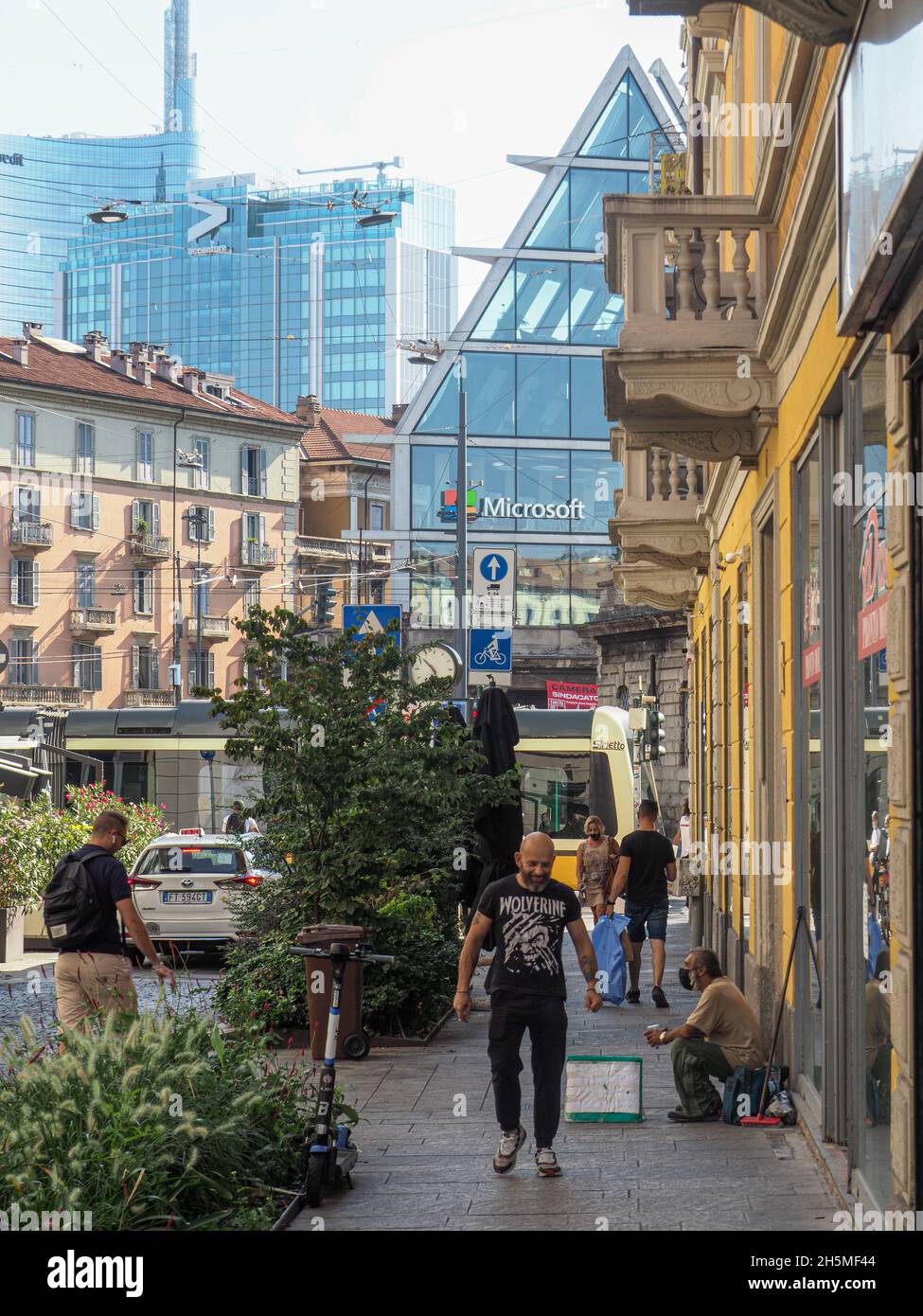 City of Milan people in the streest, electric transport and everyday ...