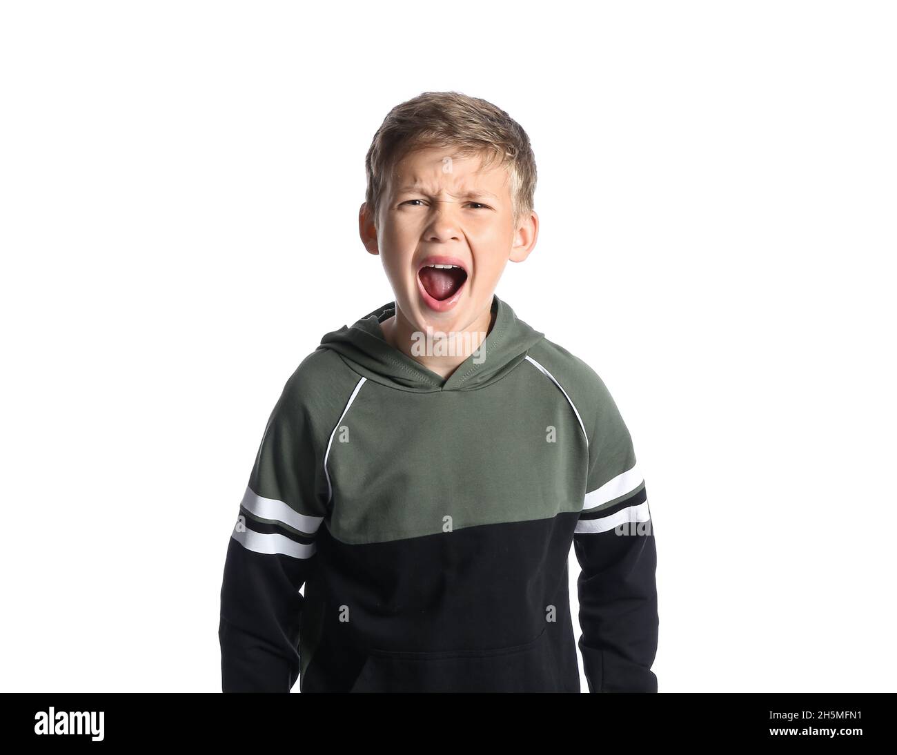 Angry little boy in hoodie shouting on white background Stock Photo - Alamy