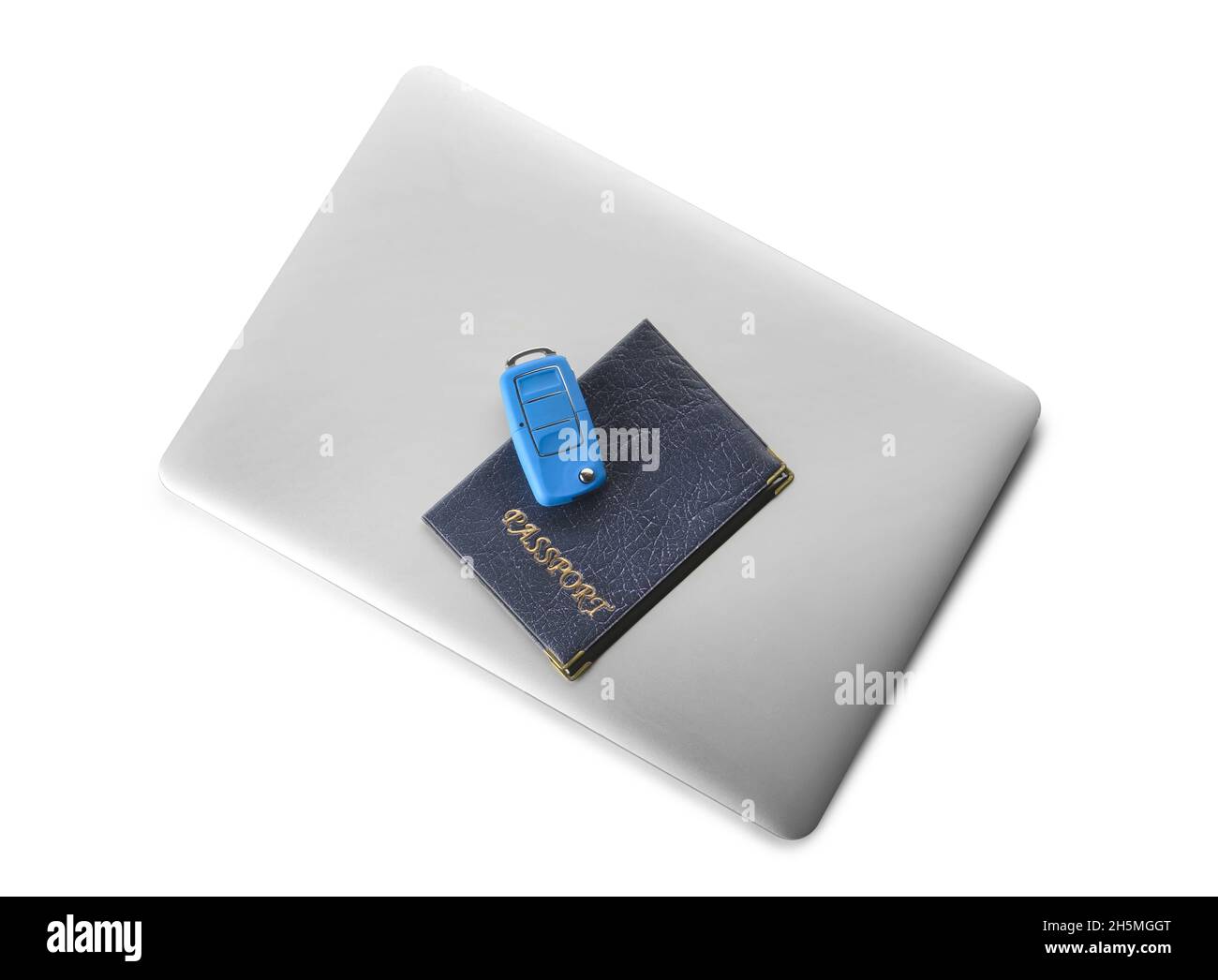 Laptop, passport and key fob on white background. Car rent concept ...