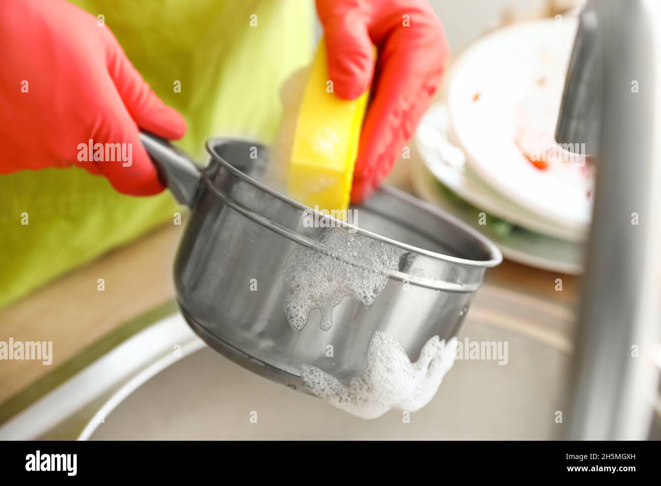 Cleaning cooking pot hi-res stock photography and images - Alamy