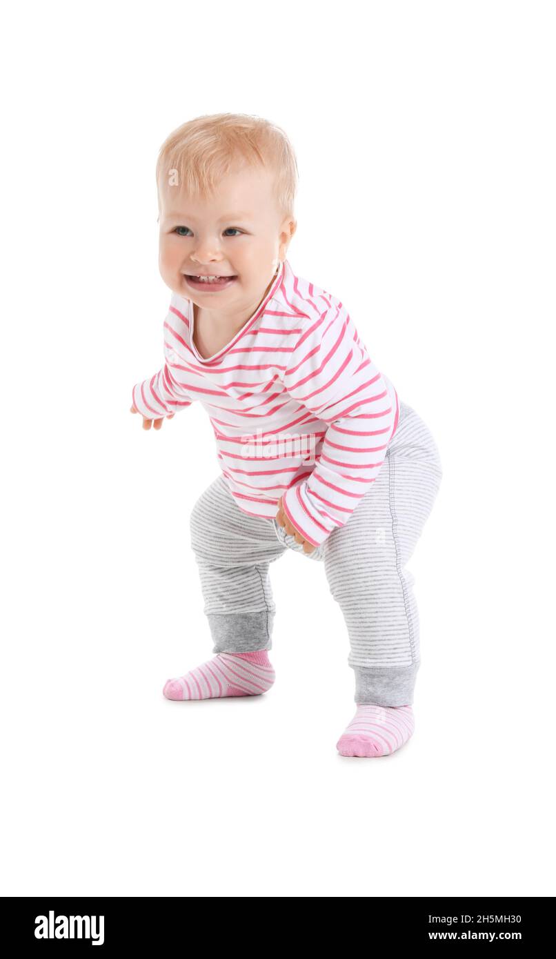 Cute baby girl learning to walk on white background Stock Photo - Alamy