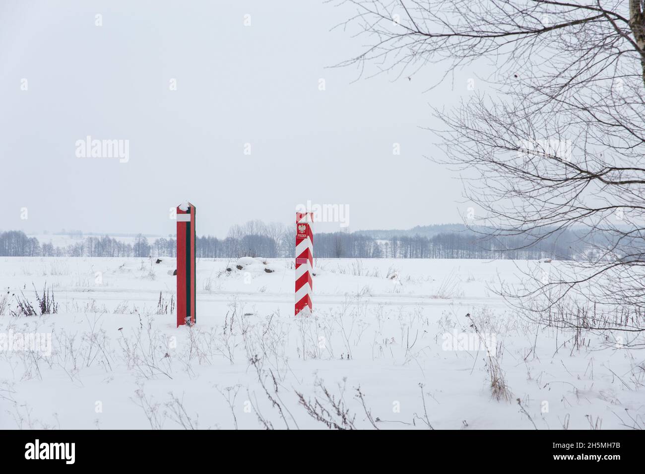 Boundary pillars of Belarus and Poland on the border in a winter field ...