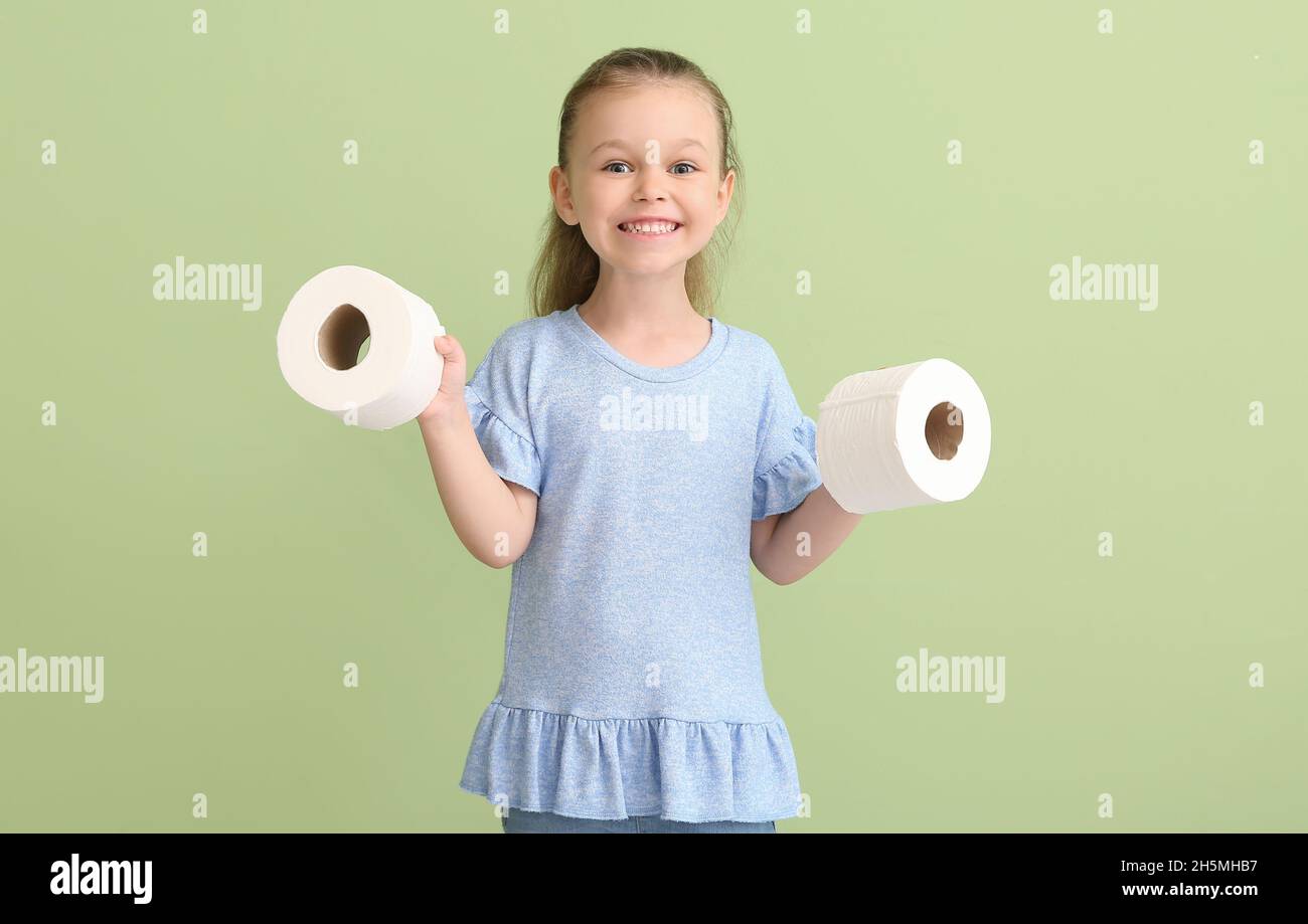 Little girl with toilet paper on color background Stock Photo - Alamy