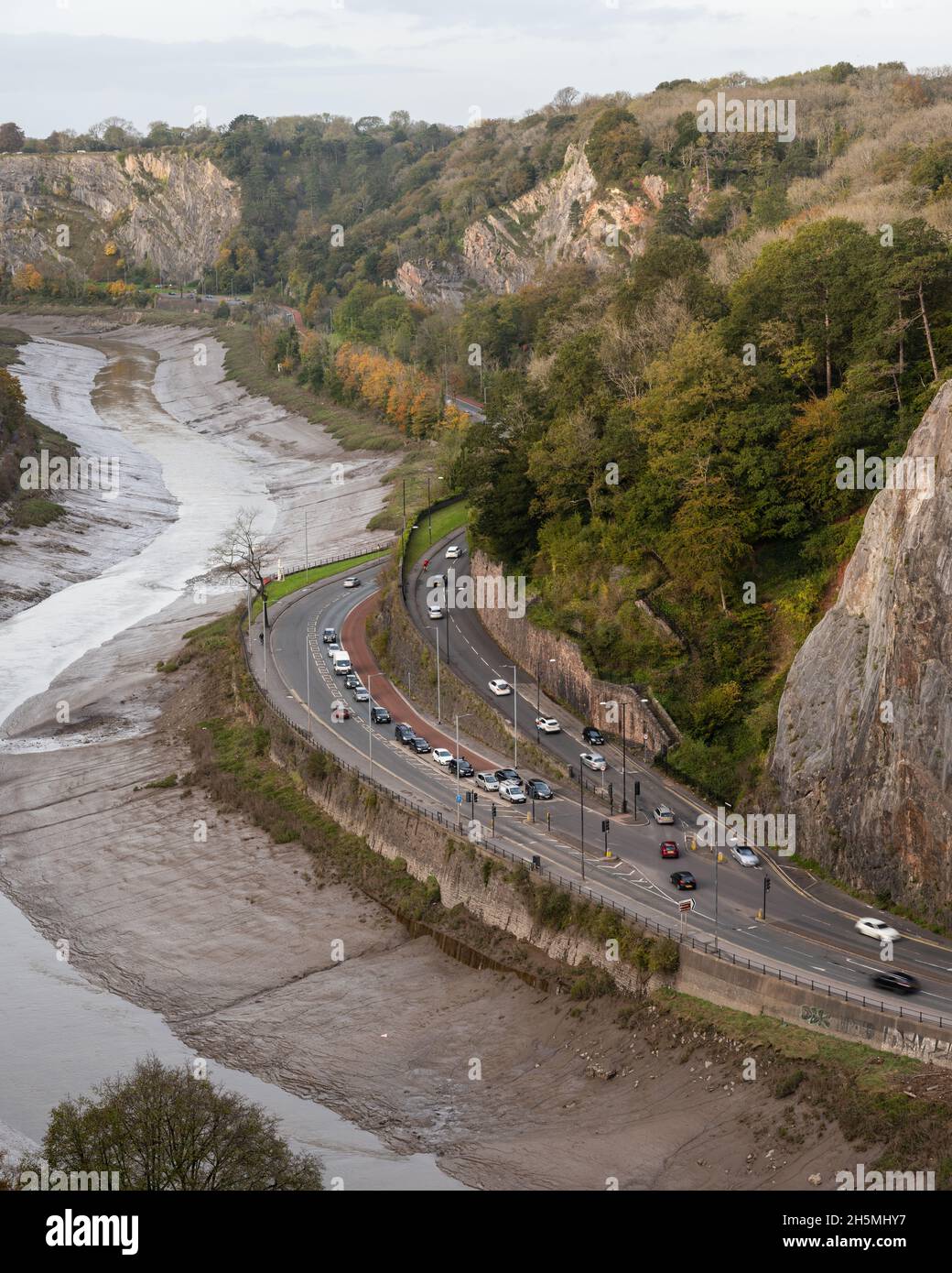 Traffic flows on the A4 Portway road through the Avon Gorge below trees ...