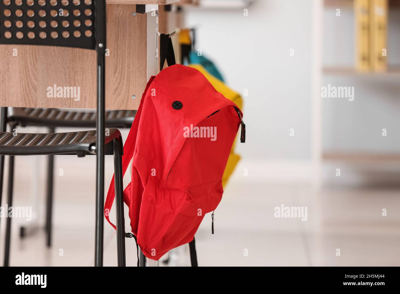 School desks chairs backpack hi-res stock photography and images - Alamy