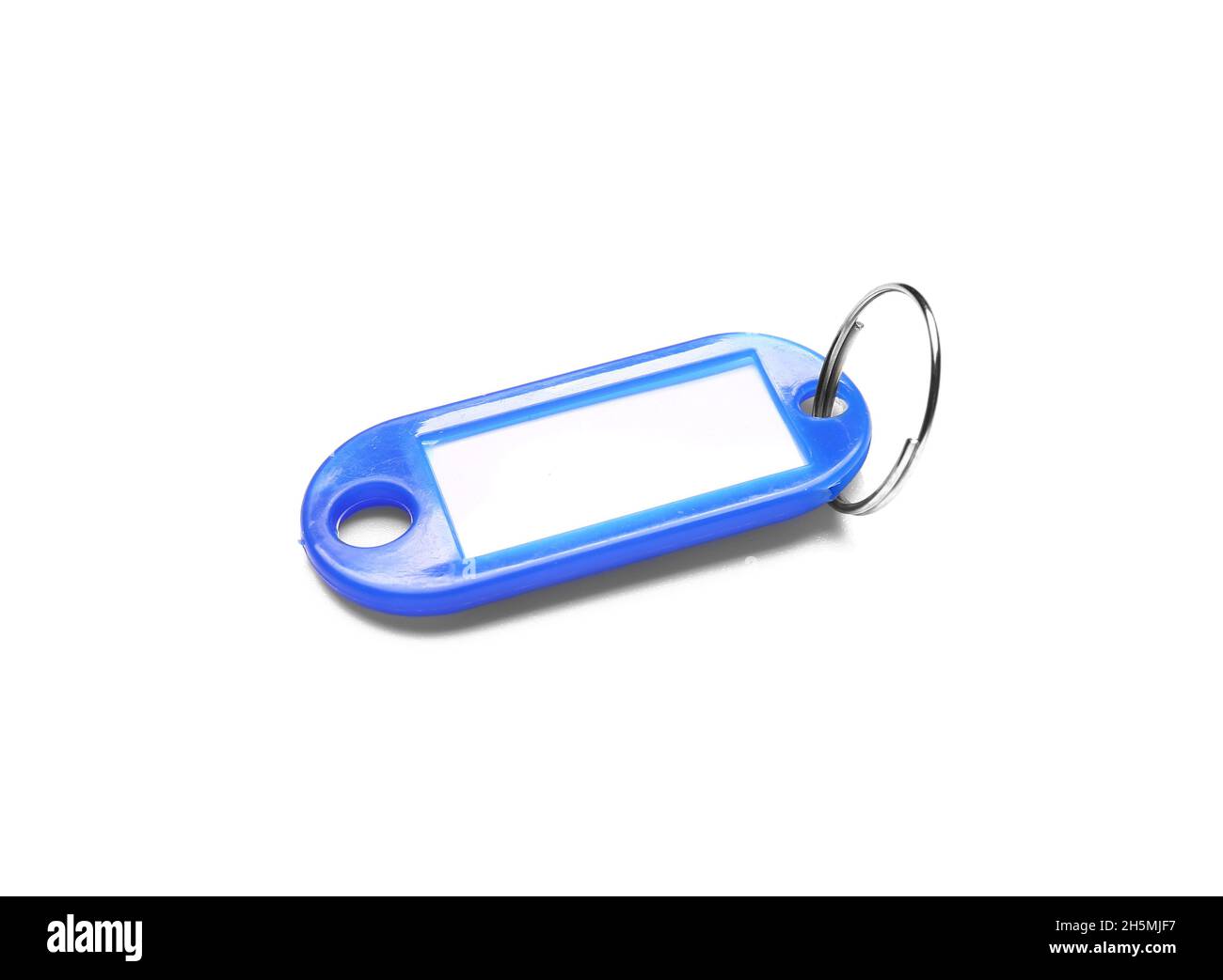 Plastic key tag on white background Stock Photo - Alamy