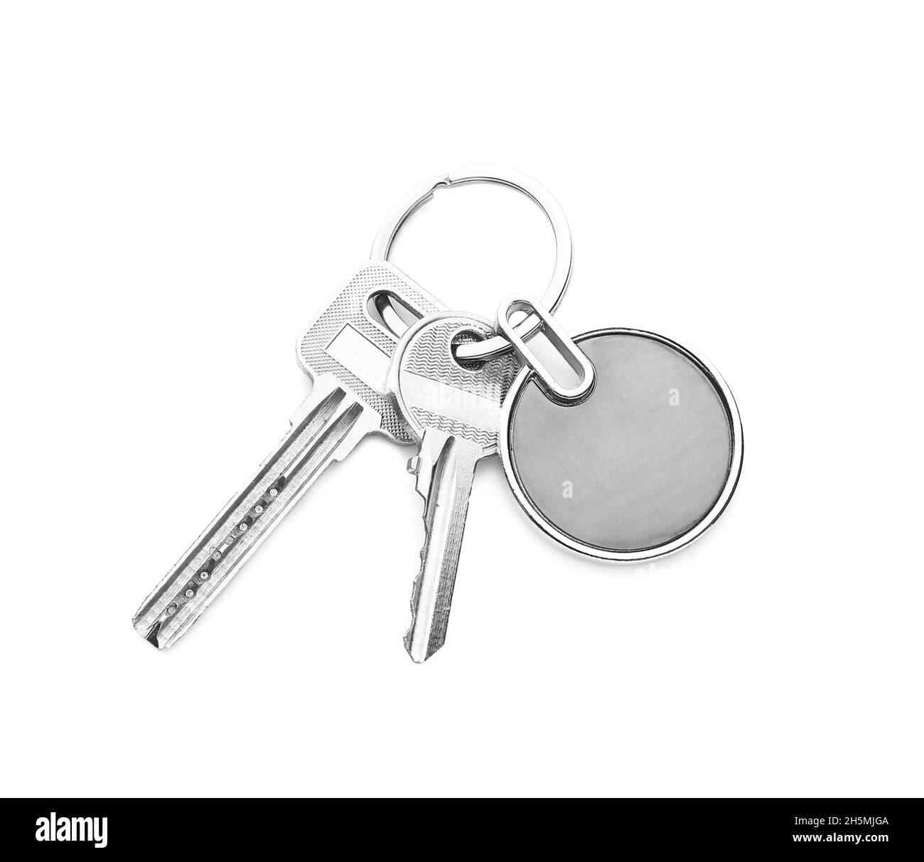 Stylish round keychain with keys on white background Stock Photo - Alamy