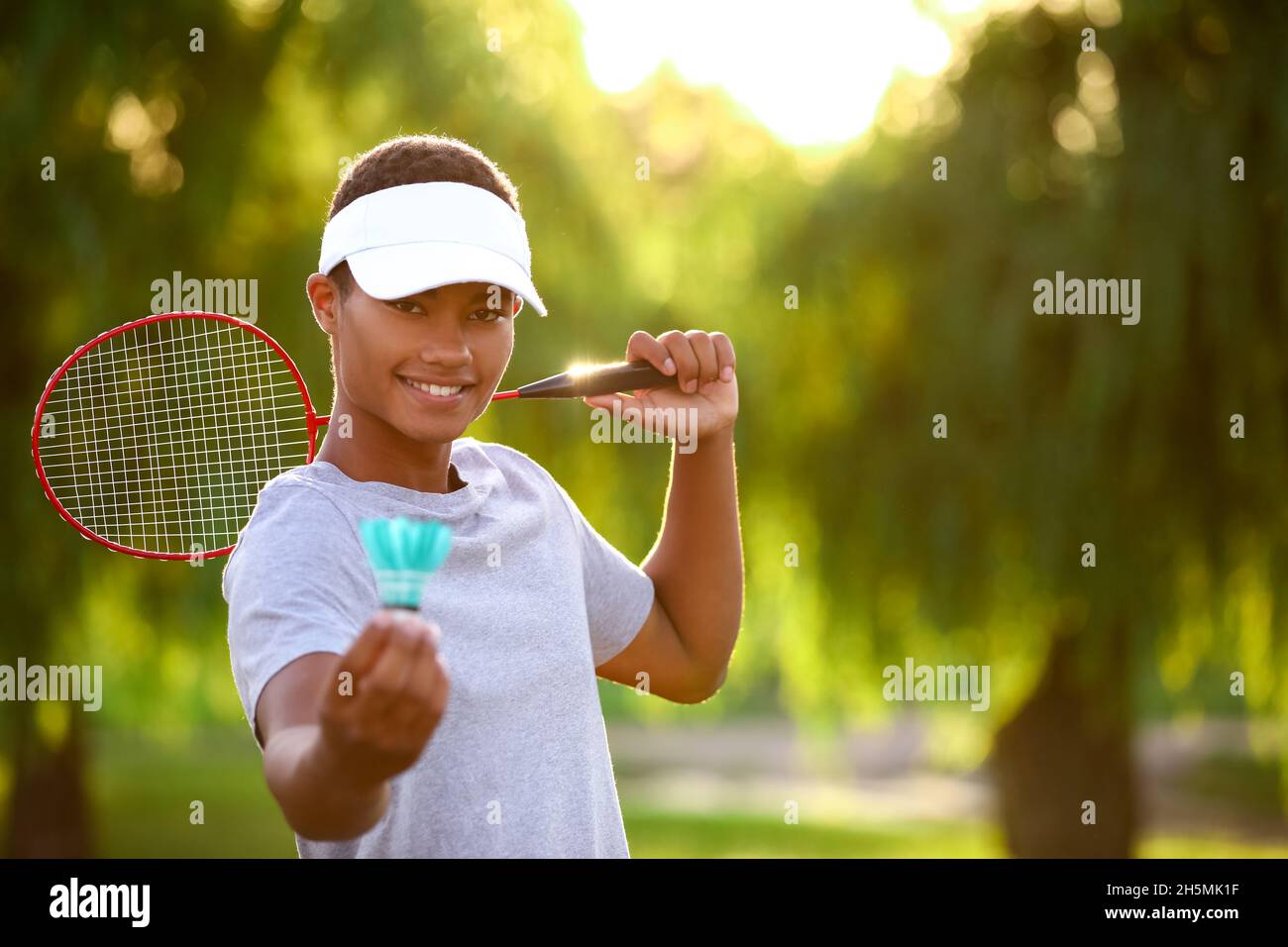 Young African-American man playing badminton outdoors Stock Photo - Alamy