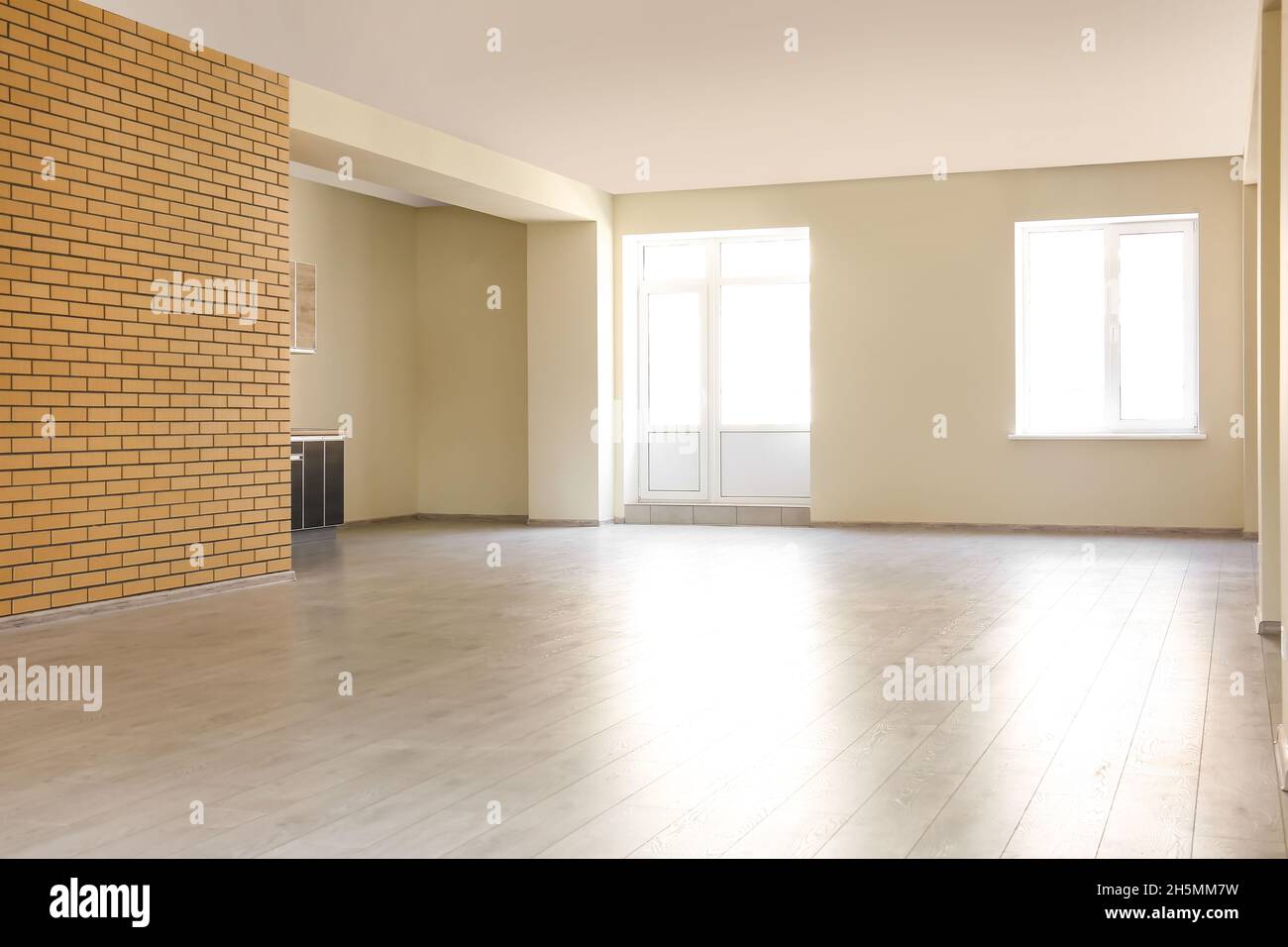 View of big empty room with windows Stock Photo - Alamy