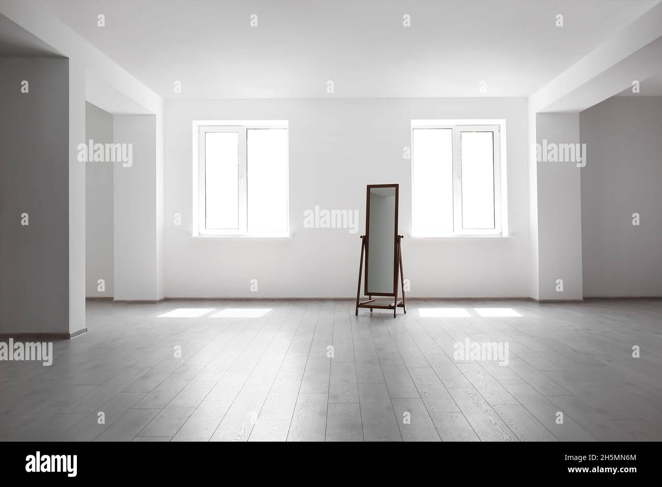 View of empty room with mirror Stock Photo - Alamy