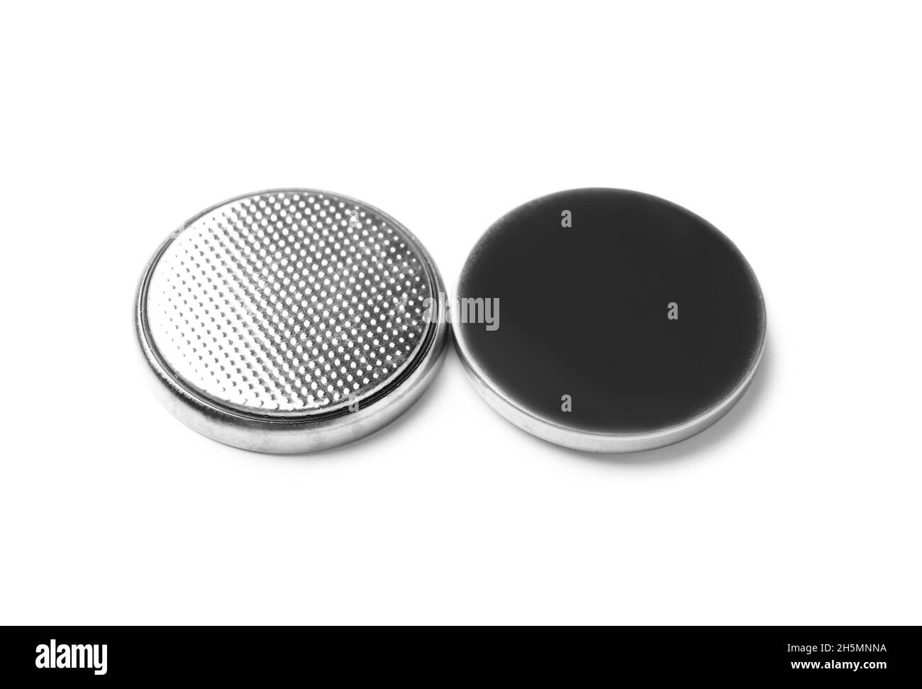 Lithium button cell batteries on white background Stock Photo - Alamy