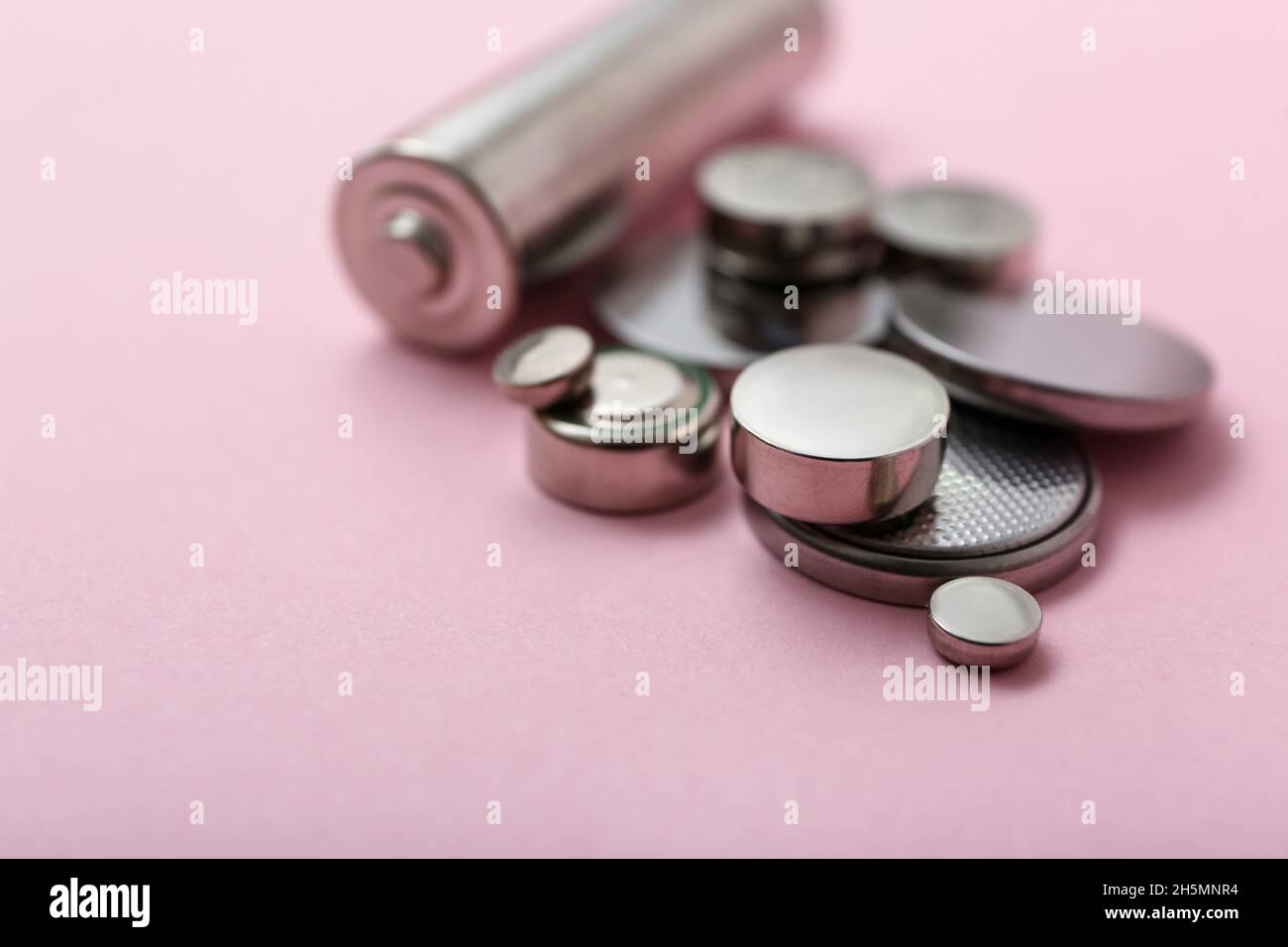 Different batteries on pink background, closeup Stock Photo - Alamy